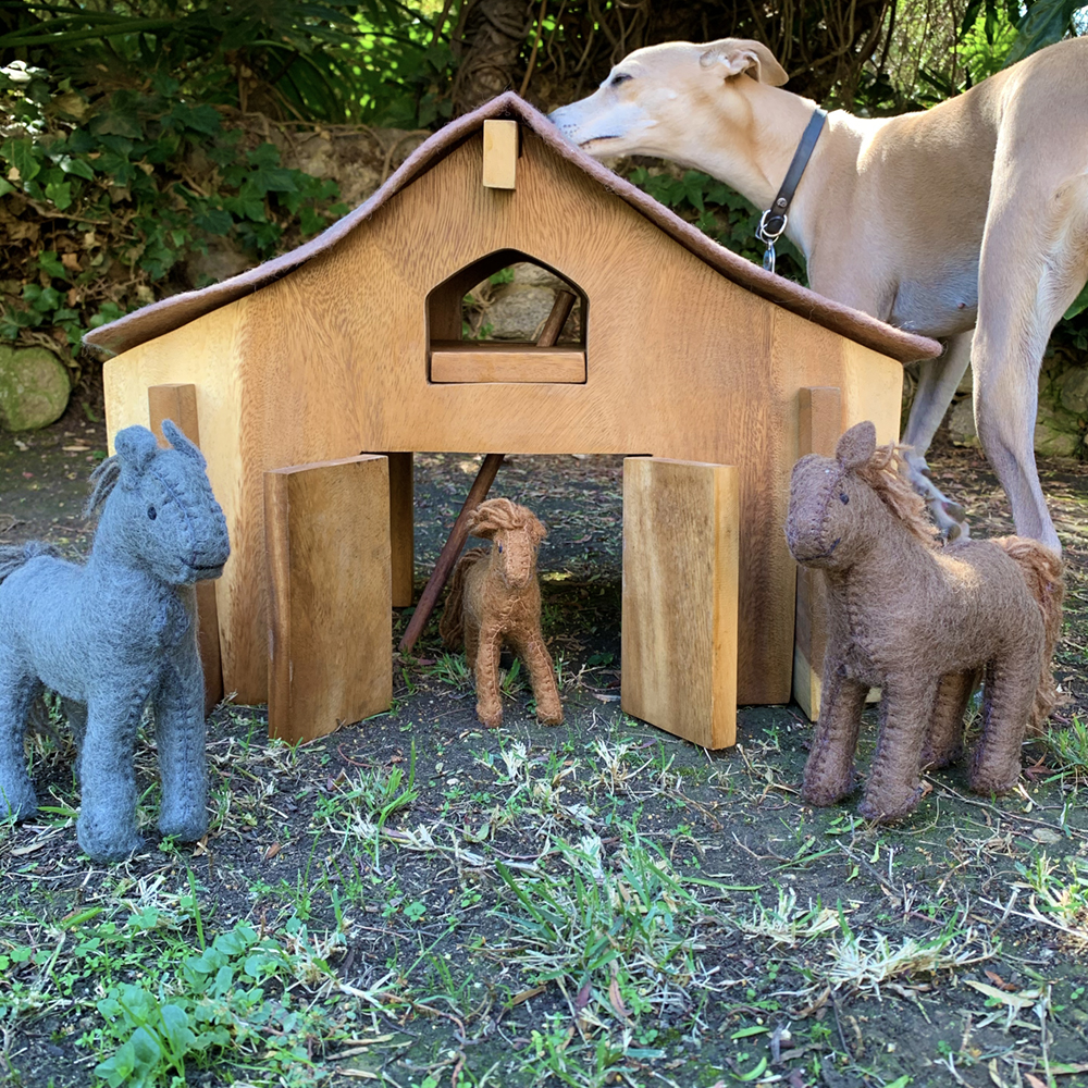 Wooden stable with felt roof